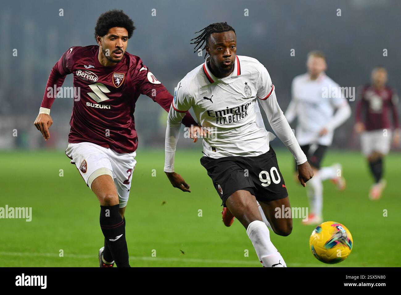 Turin, Italy. 22nd Feb, 2025. Tammy Abraham of AC Milan and Saul Coco ...