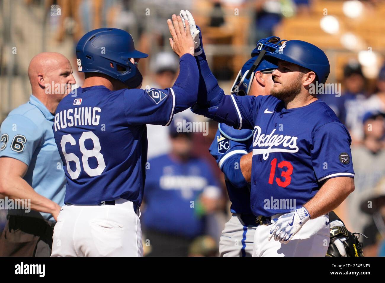 Los Angeles Dodgers' Max Muncy (13) celebrates with designated hitter ...