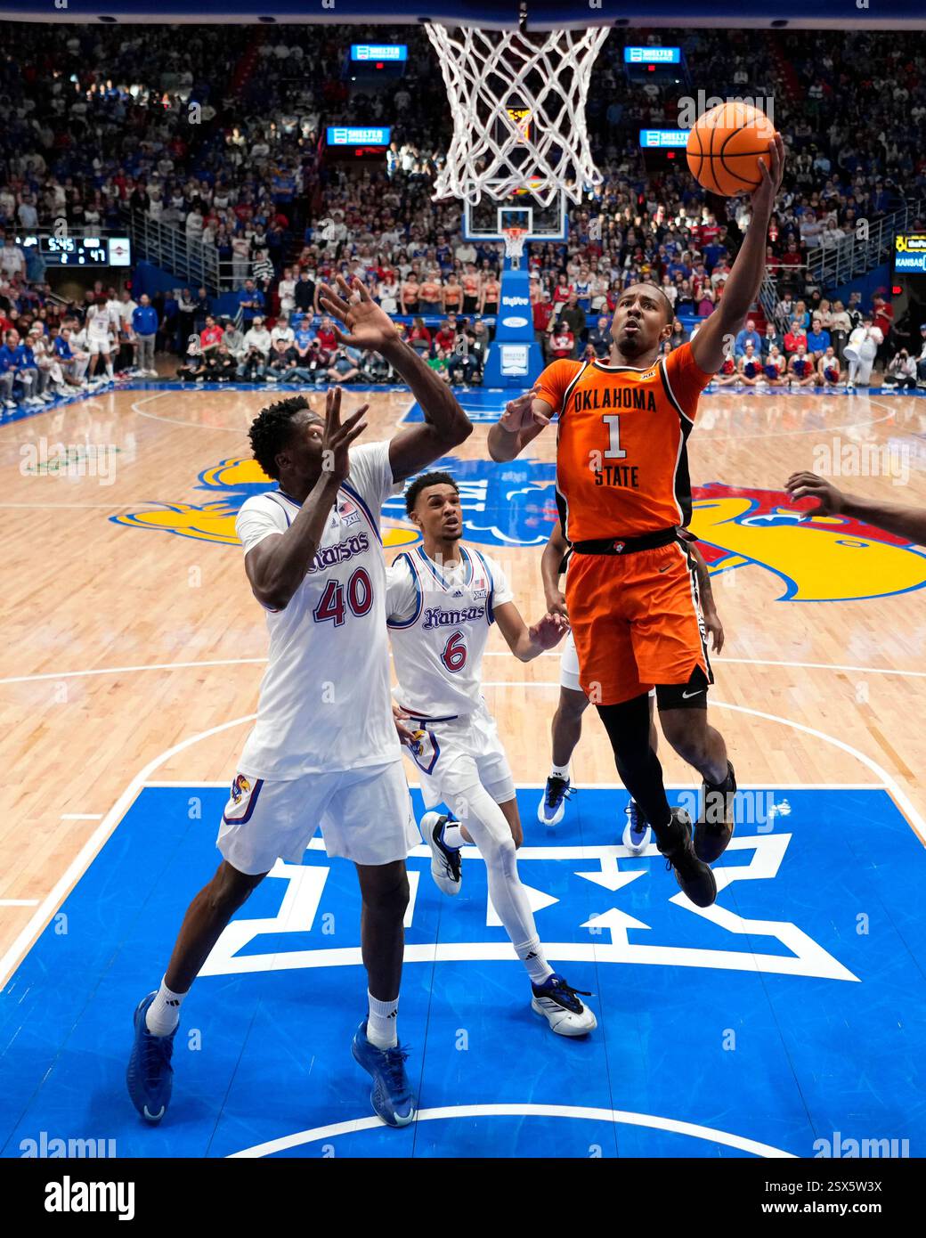 Oklahoma State guard Bryce Thompson (1) shoots over Kansas forward ...