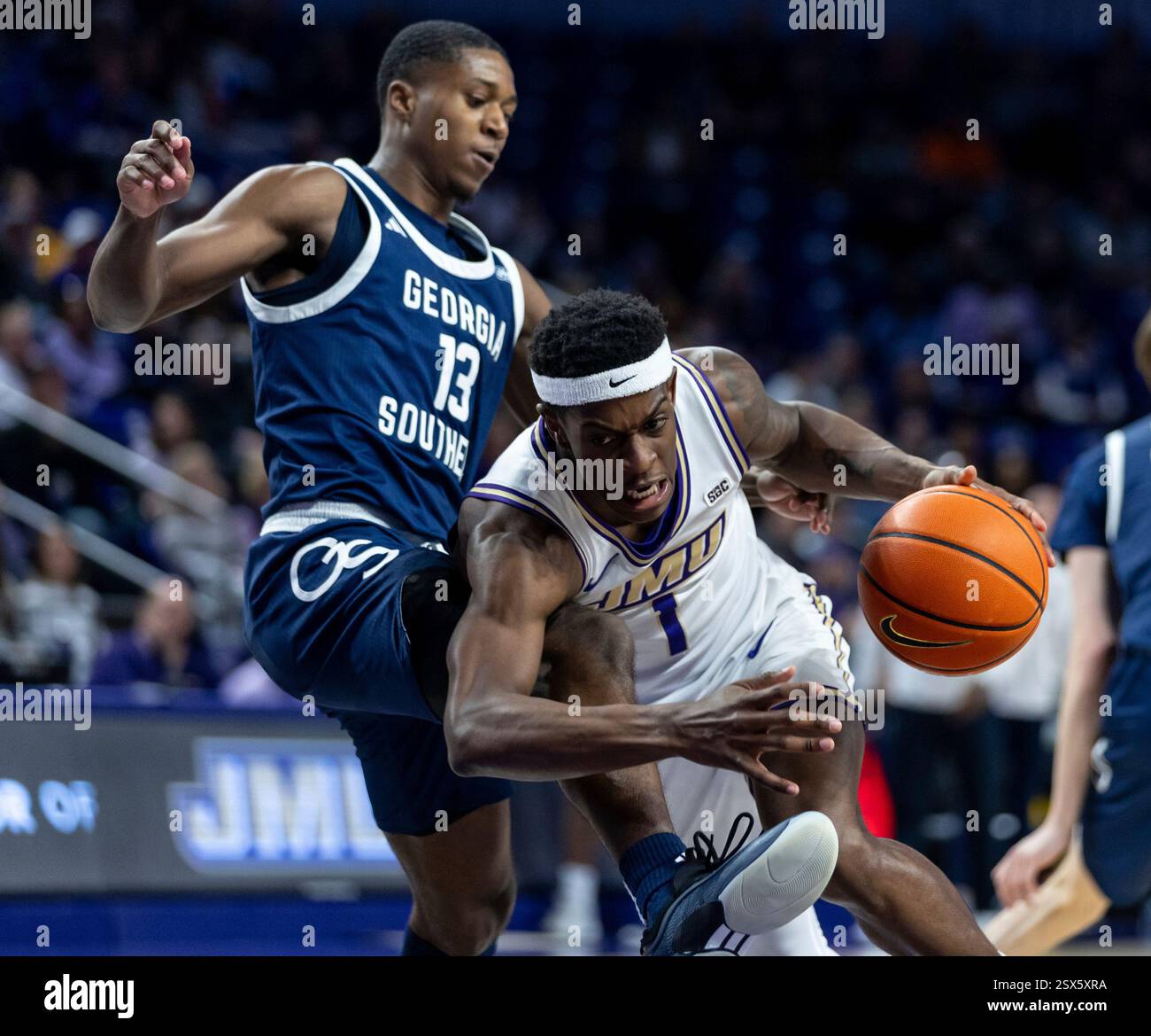James Madison guard Xavier Brown (1) drives to the basket against ...