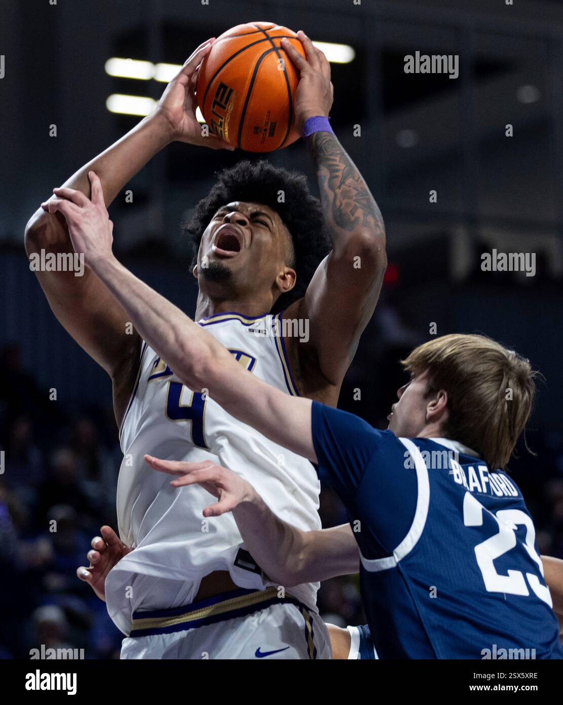 James Madison center Elijah Hutchins-Everett (4) grabs a rebound ...