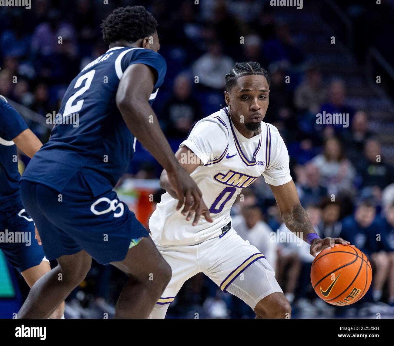 James Madison guard Mark Freeman (0) drives around Georgia Southern ...