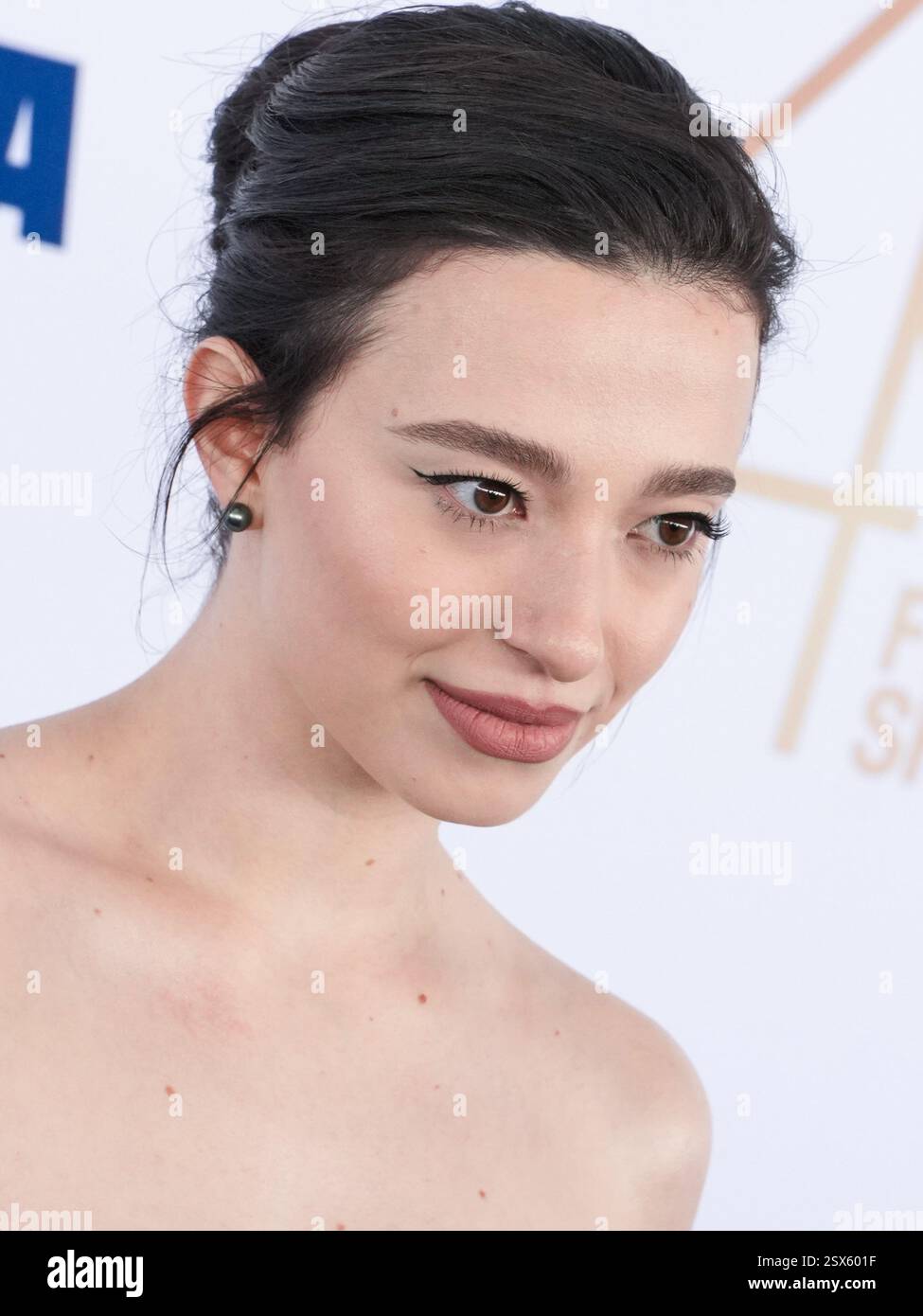 Los Angeles, USA. 22nd Feb, 2025. Mikey Madison walking on the red ...