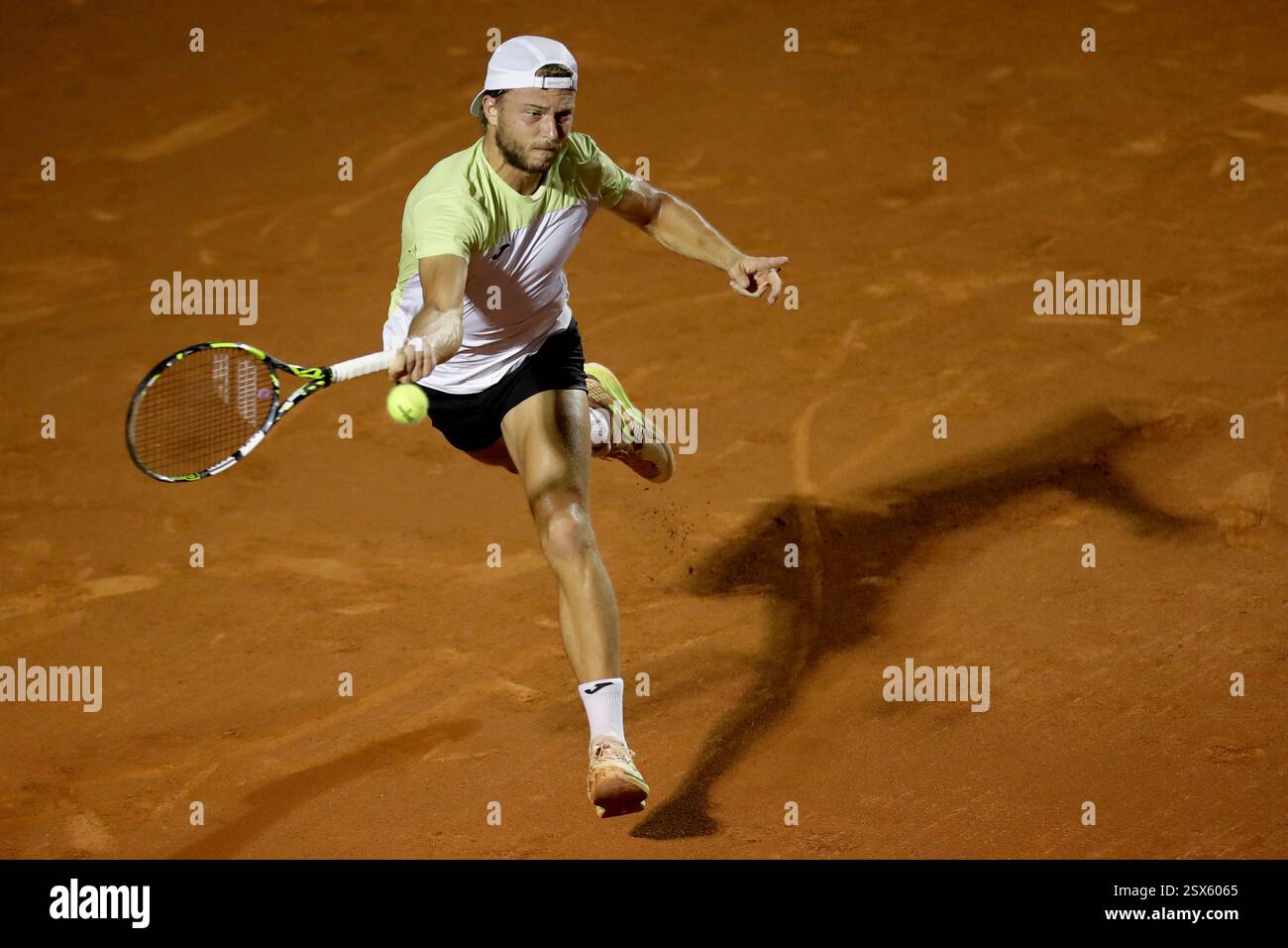 Alexandre Muller, of France, returns the ball to Argentina's Francisco ...