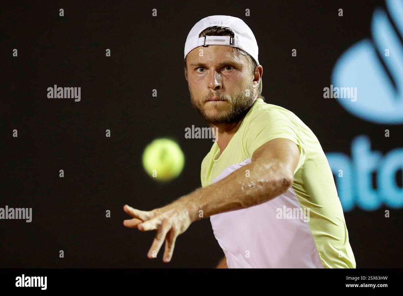 Alexandre Muller, of France, returns the ball to Argentina's Francisco ...
