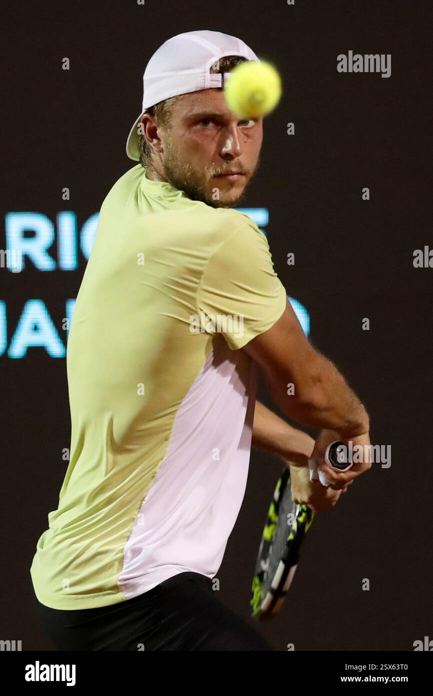 Alexandre Muller, of France, returns the ball to Argentina's Francisco ...