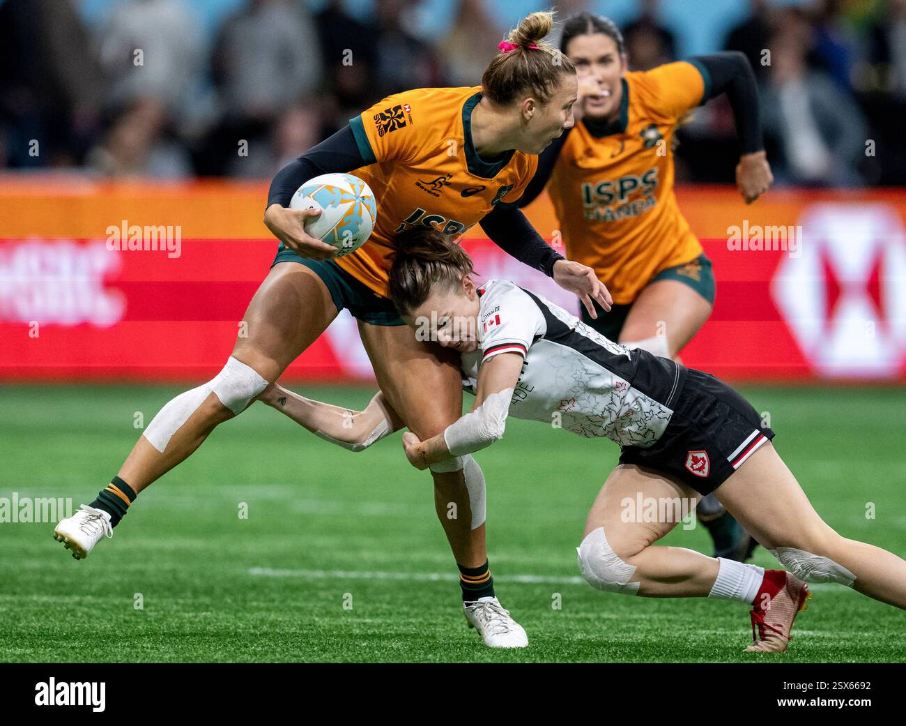 Vancouver, Canada. 22nd Feb, 2025. Canada's Piper Logan, right, tackles ...