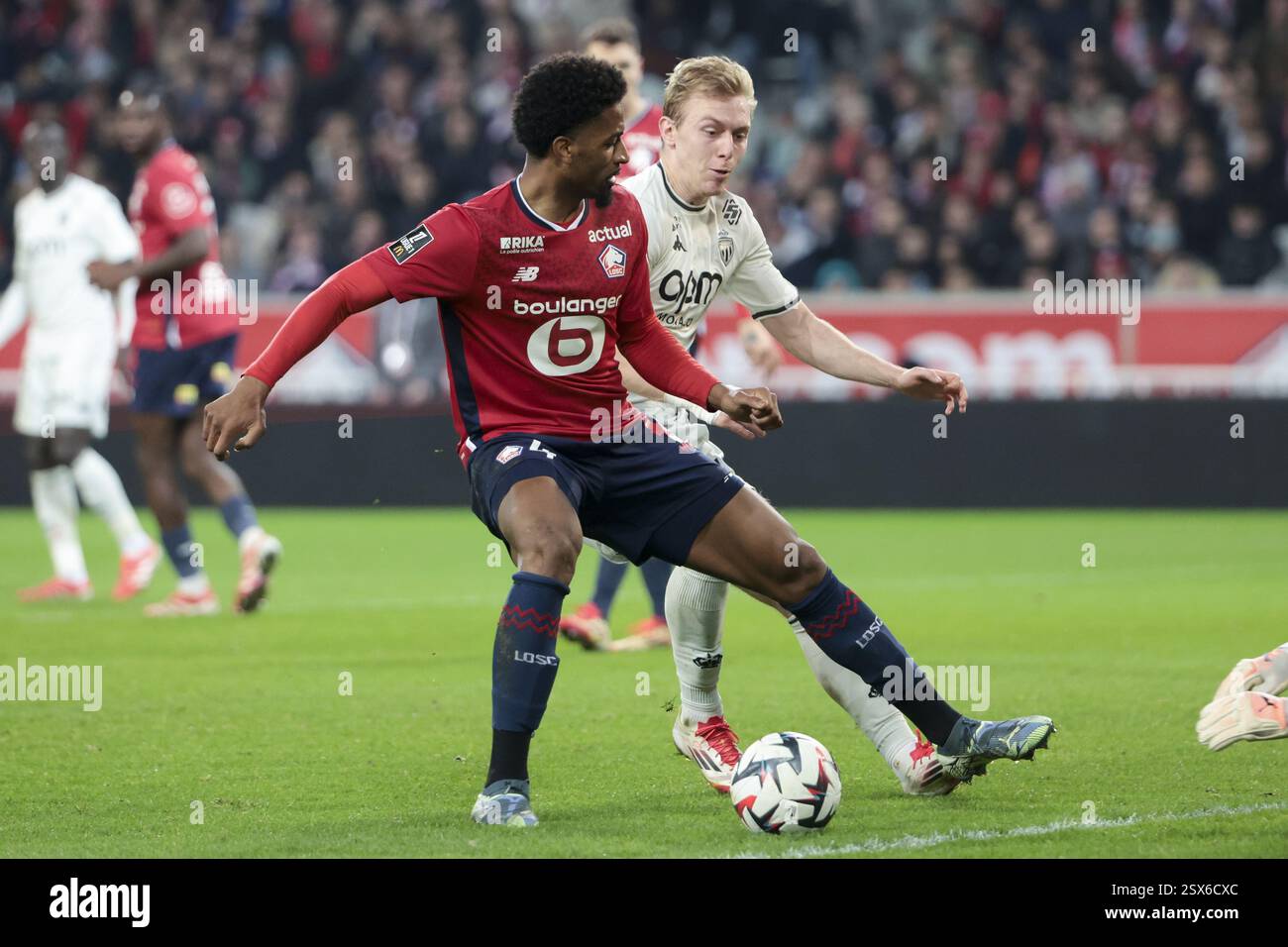 Alexsandro Ribeiro of Lille, Mika Biereth of Monaco during the French ...