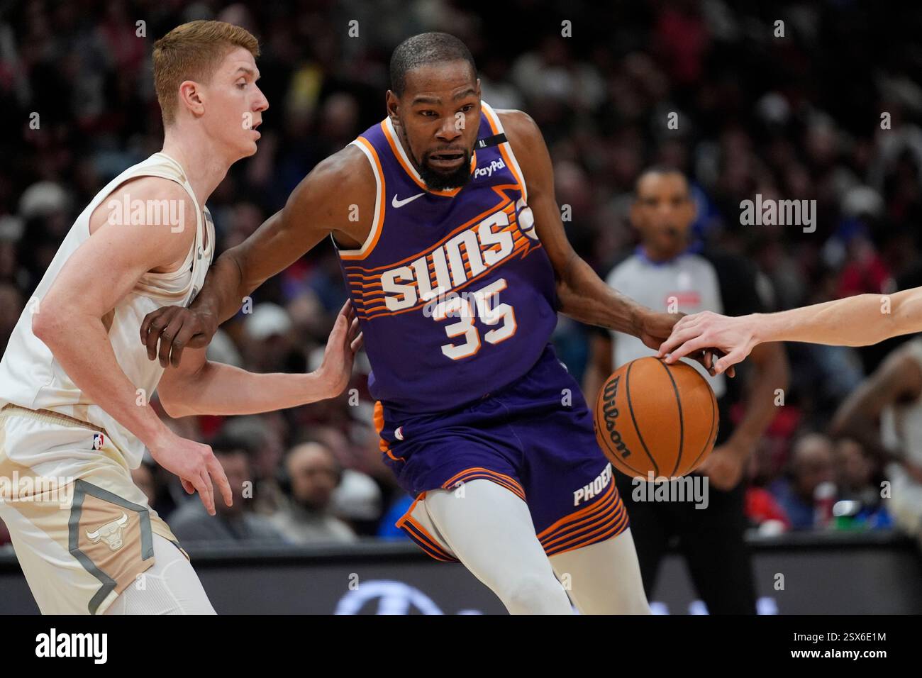 Chicago Bulls guard Kevin Huerter (13), left, fouls Phoenix Suns ...