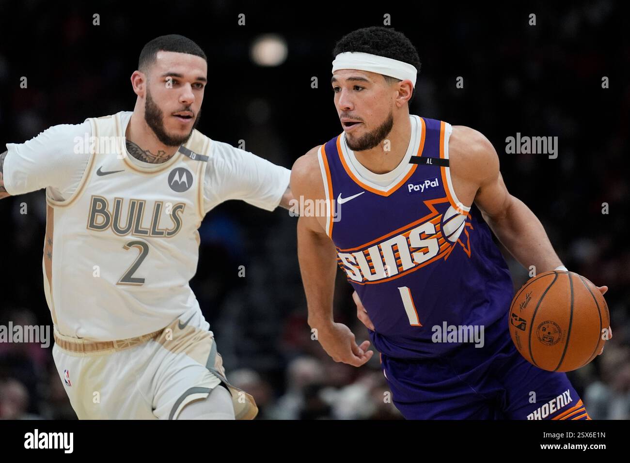 Chicago Bulls guard Lonzo Ball (2), left, guards Phoenix Suns guard ...