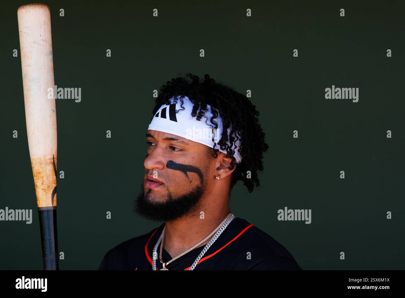 San Francisco Giants' Luis Matos holds a bat in the dugout before a ...