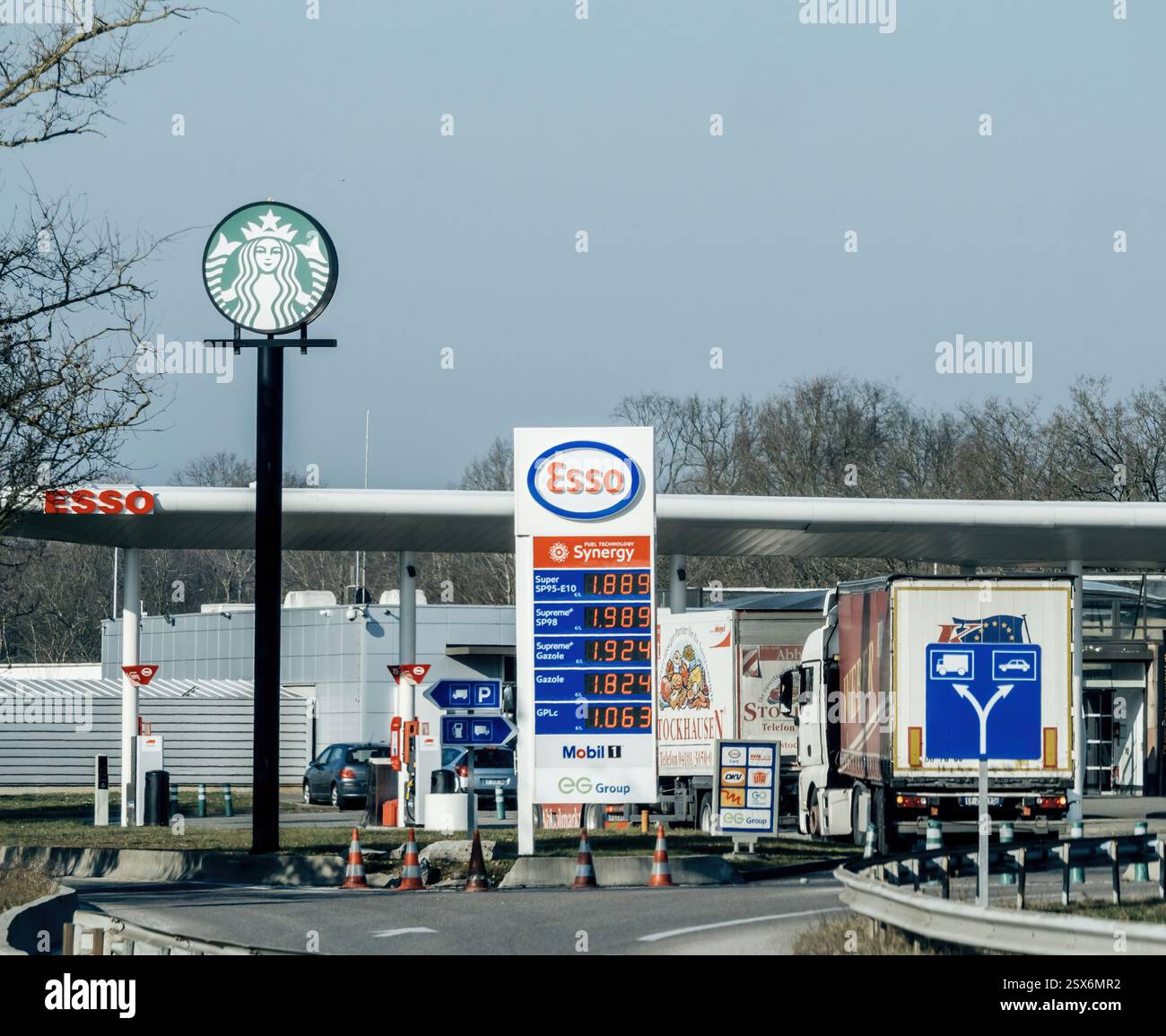 Haguenau, France - Feb 18, 2025: A highway Esso gas station with a ...