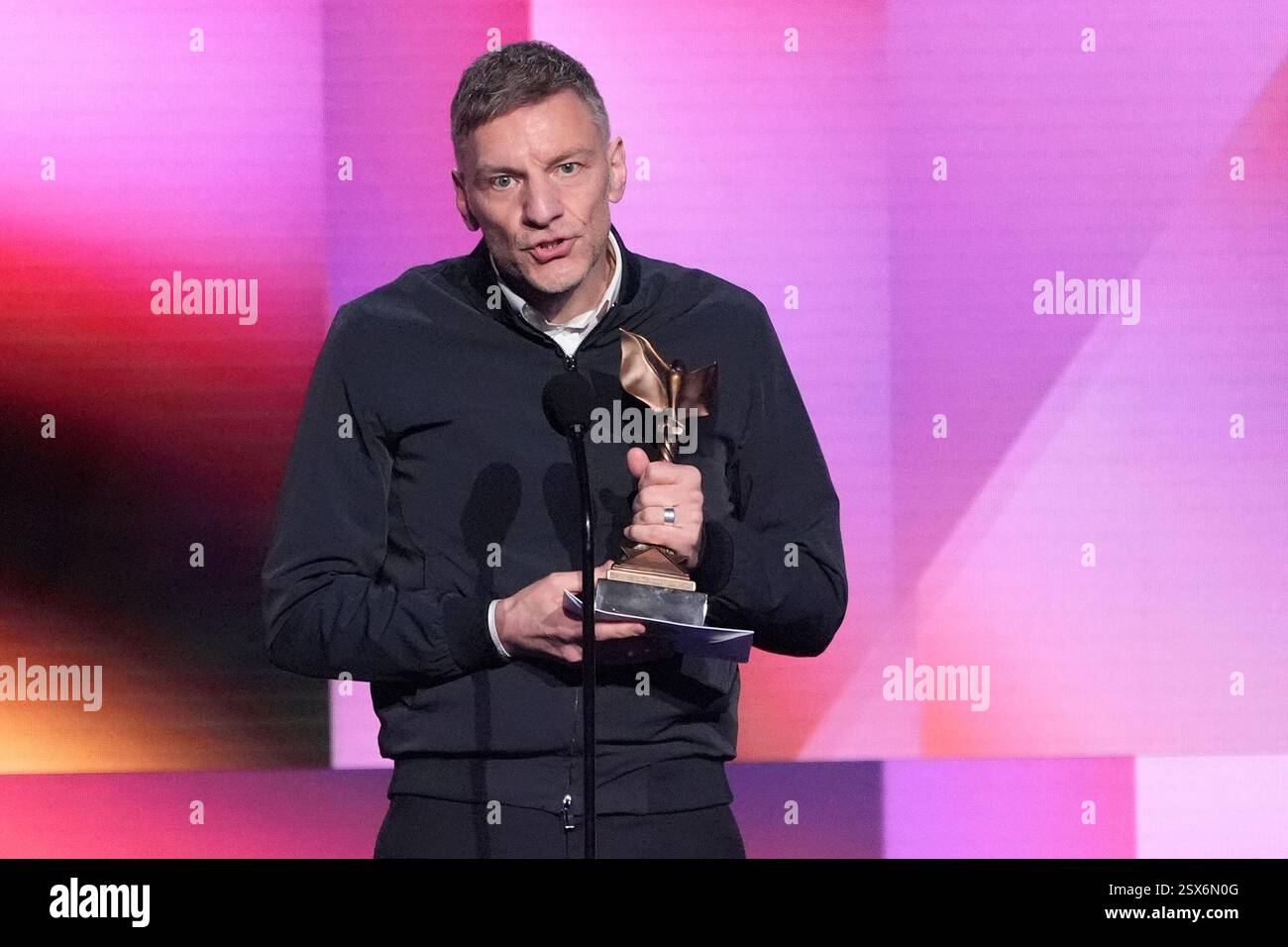Hansjorg Weissbrich accepts the award for best editing for "September 5 ...