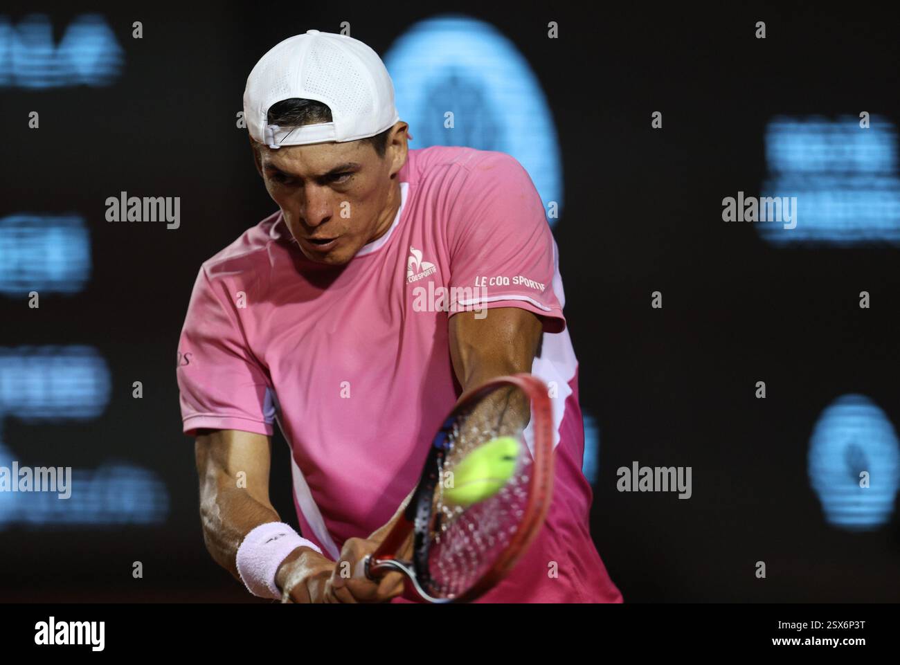 (250223) -- BRAZIL, Feb. 23, 2025 (Xinhua) -- Sebastian Baez of Argentina hits a return during ...