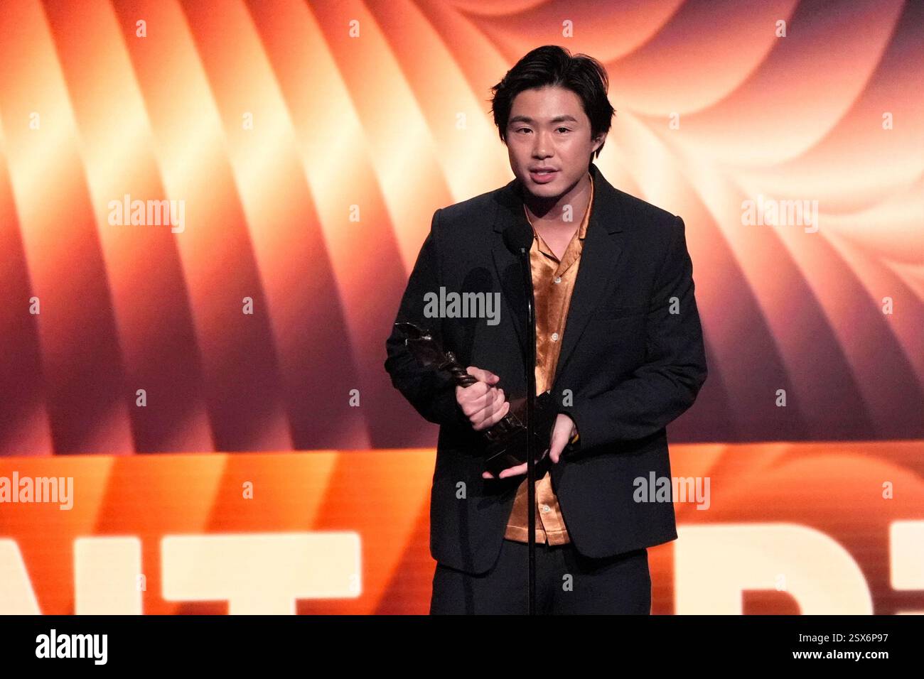 Sean Wang accepts the award for best first screenplay for "Didi" during ...