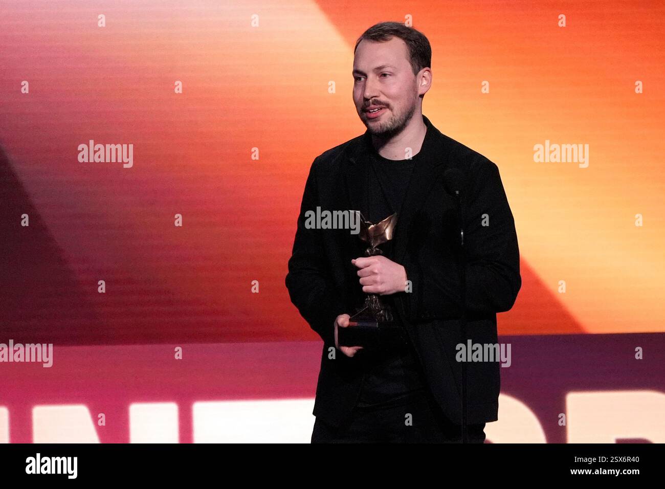 Gints Zilbalodis accepts the award for best international film for ...
