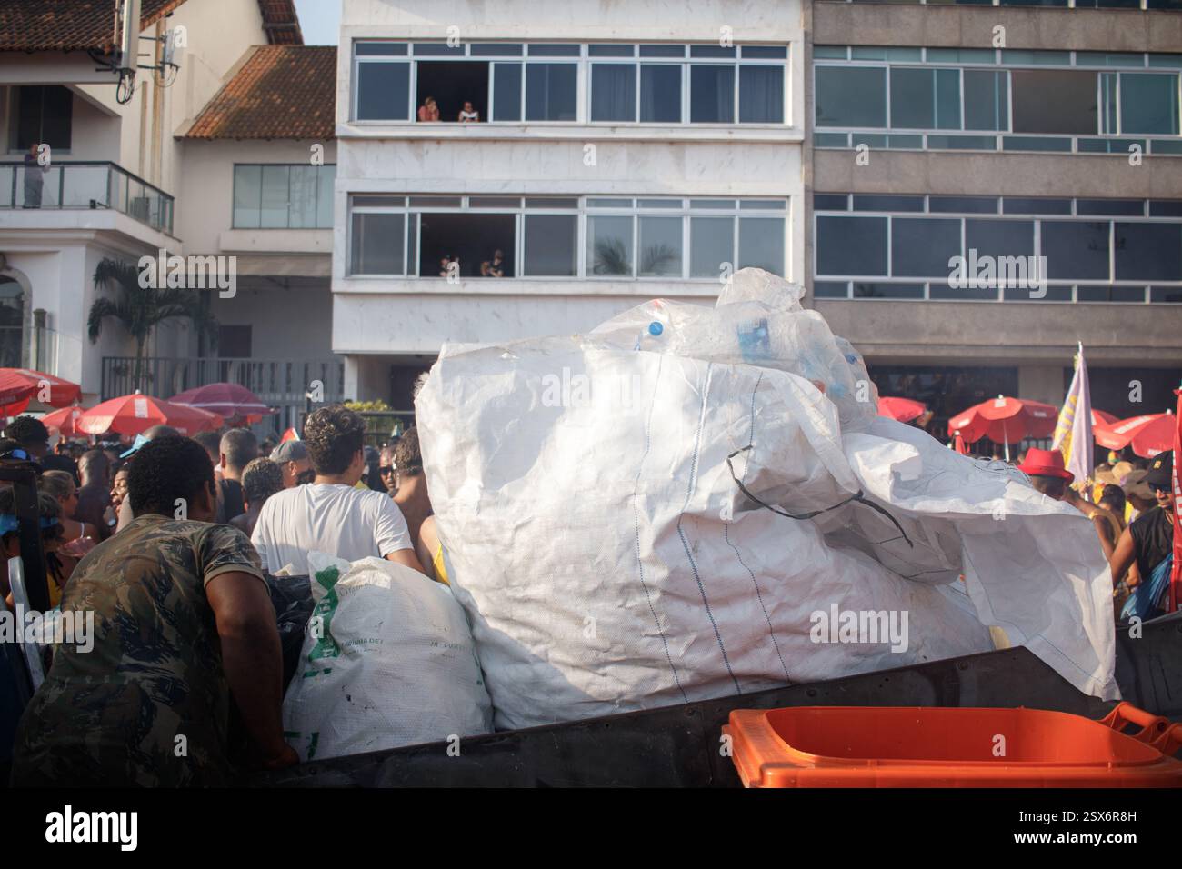 Rio De Janeiro, Brazil. 22nd Feb, 2025. Street vendor watching the ...