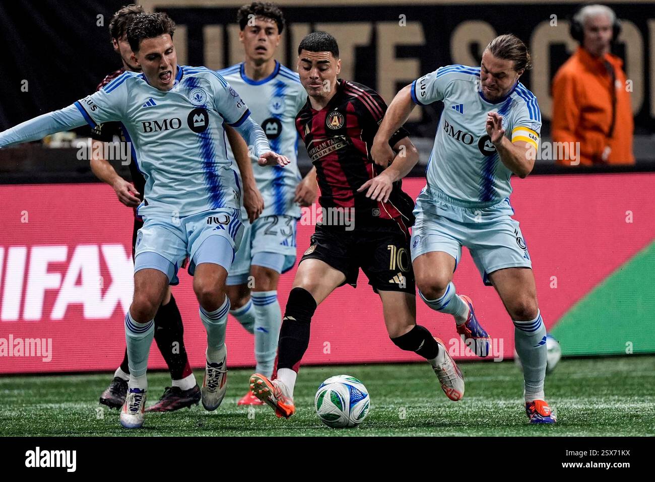 CF Montreal midfielder Bryce Duke, front left, and Samuel Piette, right ...