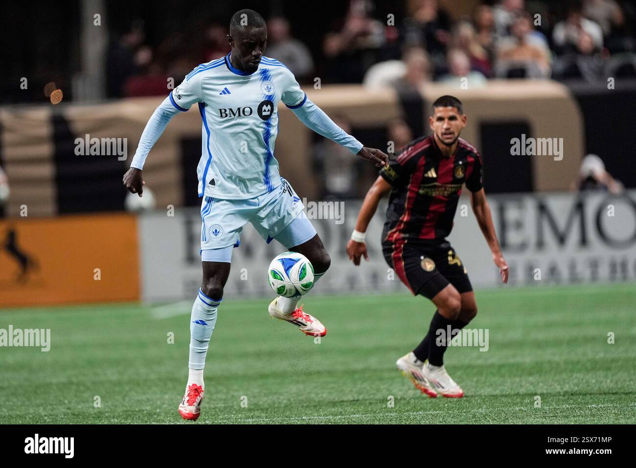 CF Montreal forward Prince Osei Owusu, left, moves the ball against ...