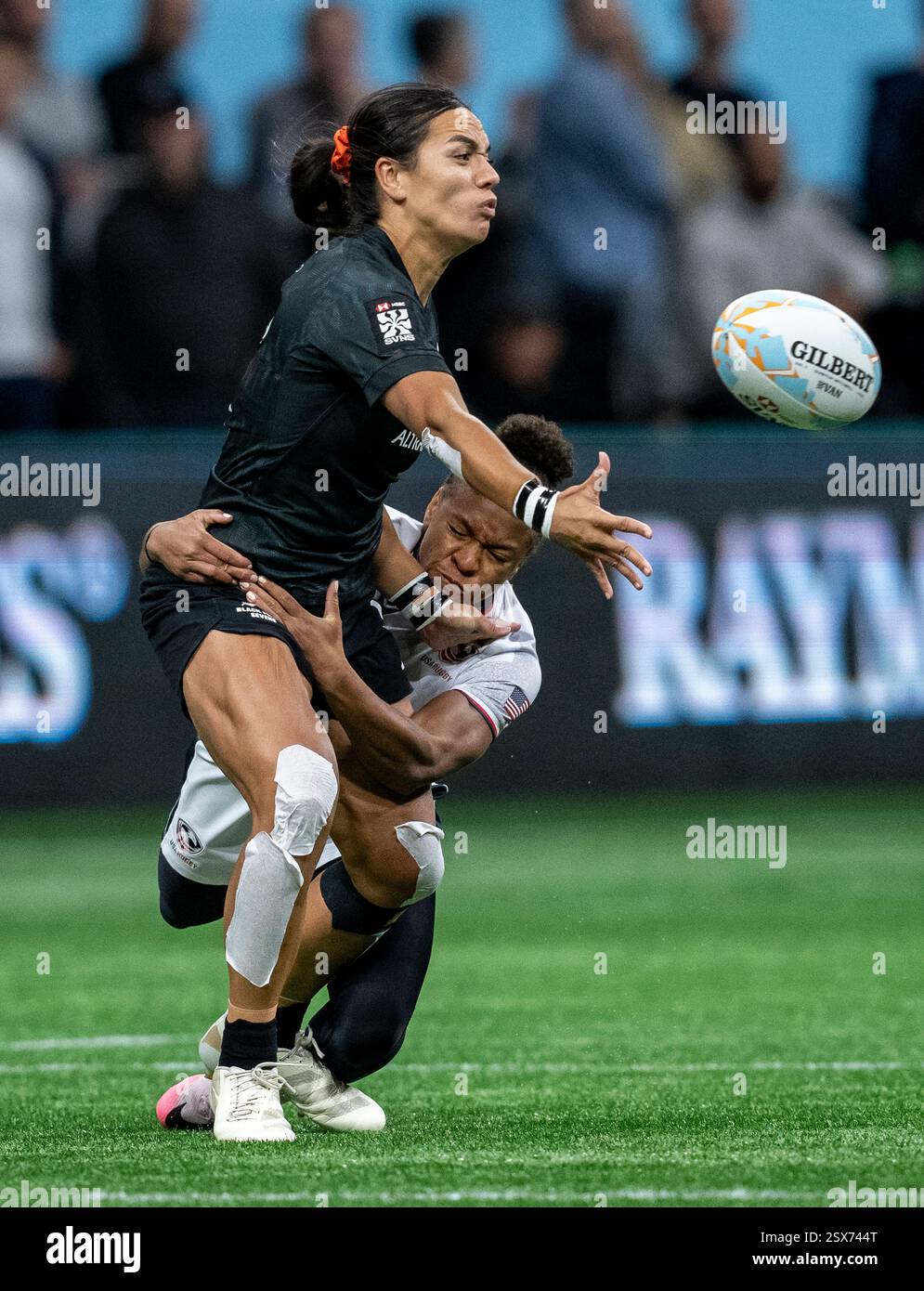 United States' Ariana Ramsey, back, tackles, New Zealand's Stacey Waaka ...