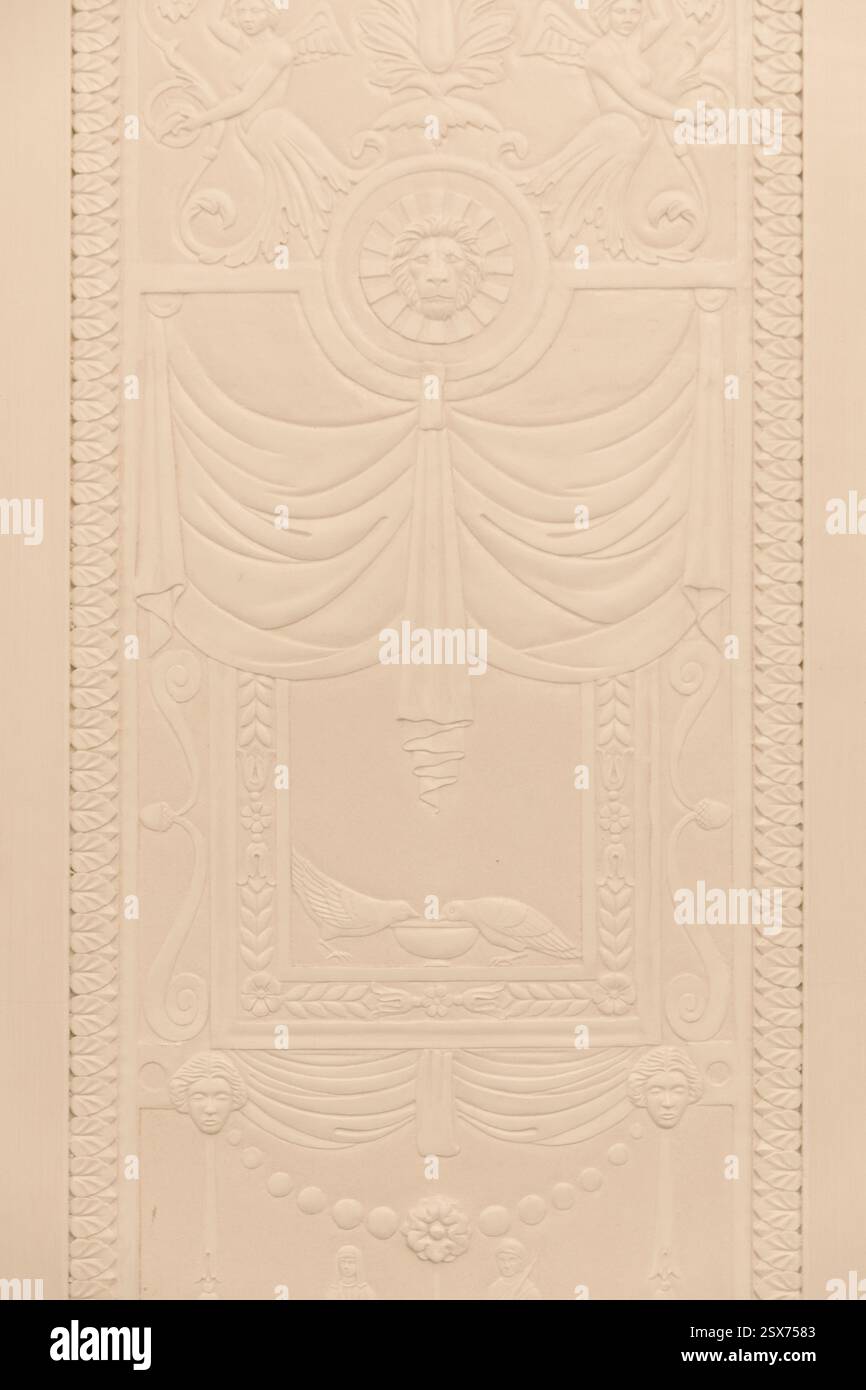 Detailed wall panel showcases artistic carvings of sun motifs and ...