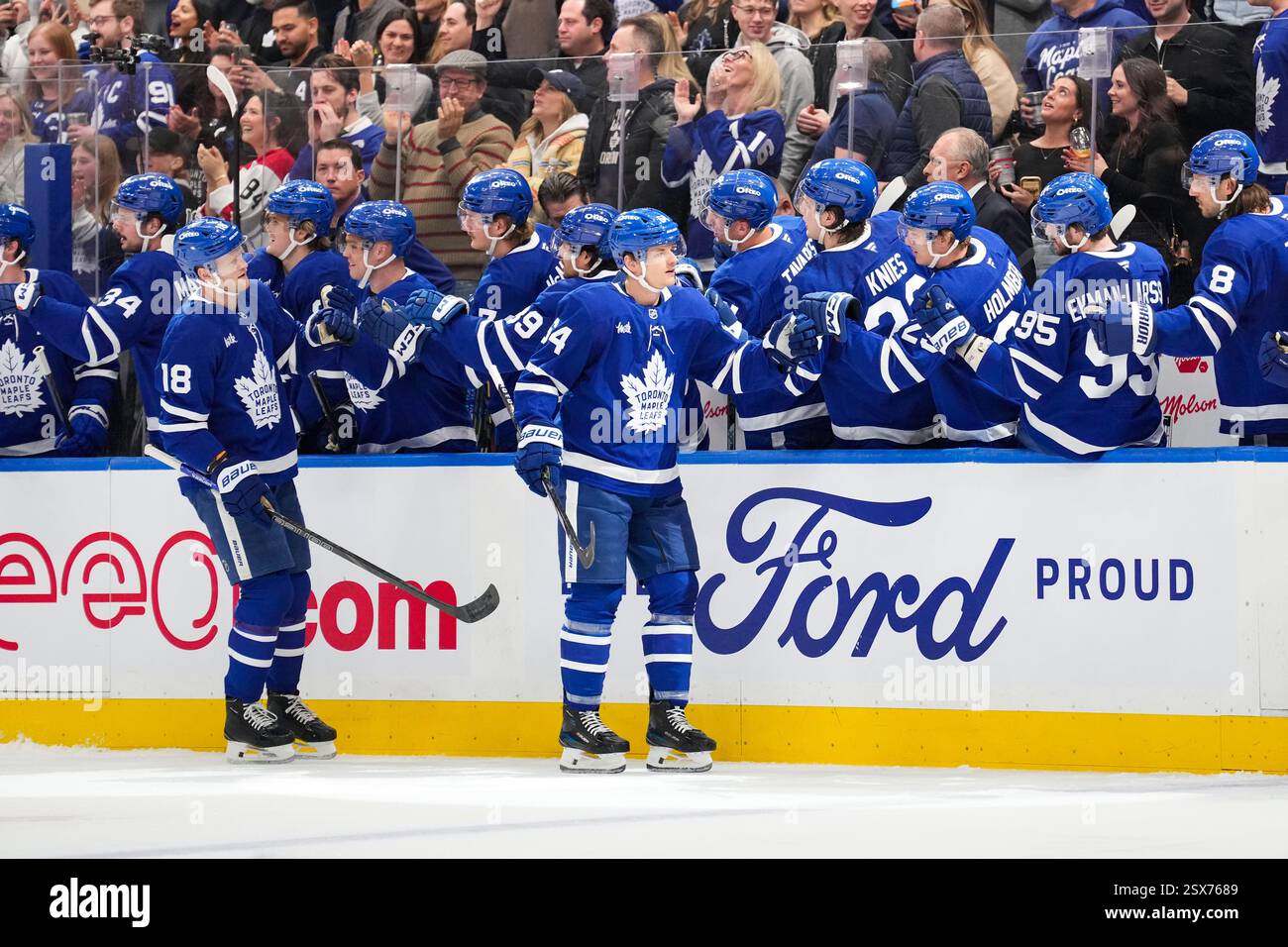 Toronto Maple Leafs center David Kampf (64) and Steven Lorentz (18) are ...