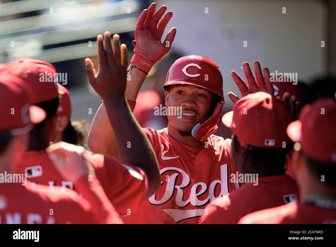 Cincinnati Reds third base Noelvi Marte celebrates in the dugout after ...