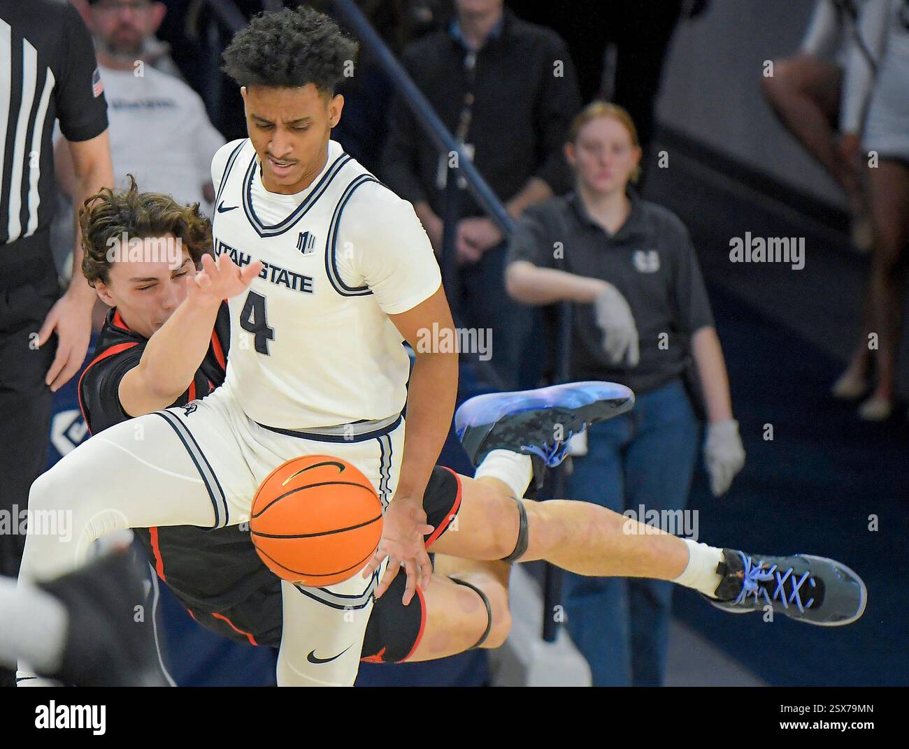 Utah State guard Ian Martinez (4) is fouled by San Diego State forward ...