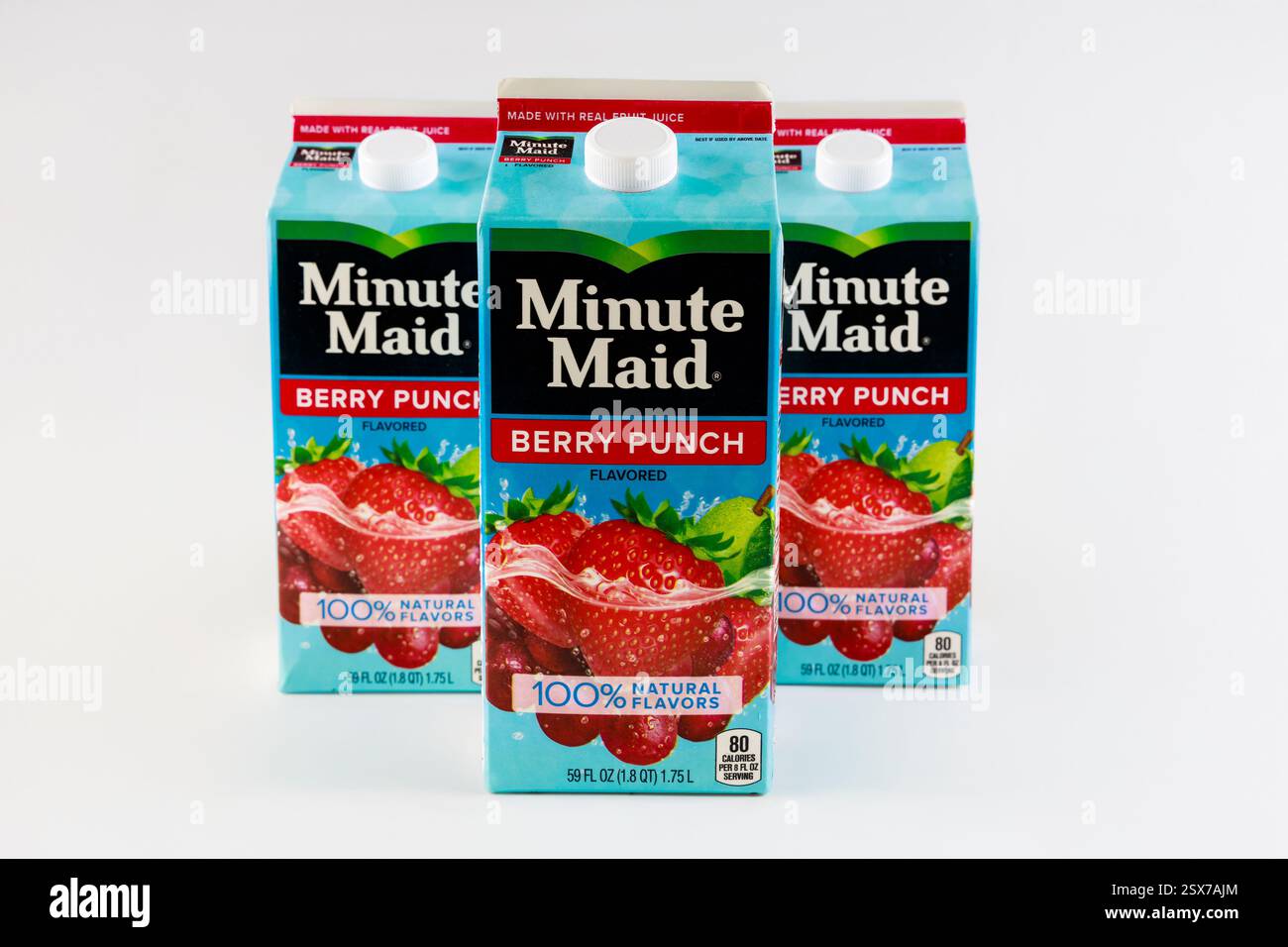 Three cartons of berry punch drink arranged on white background in ...