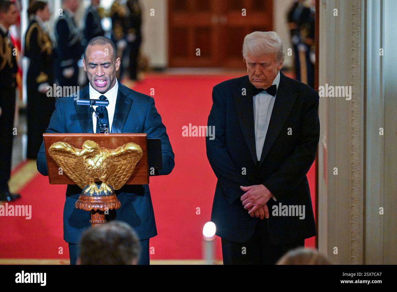 Housing and Urban Development Secretary Scott Turner prays as President ...