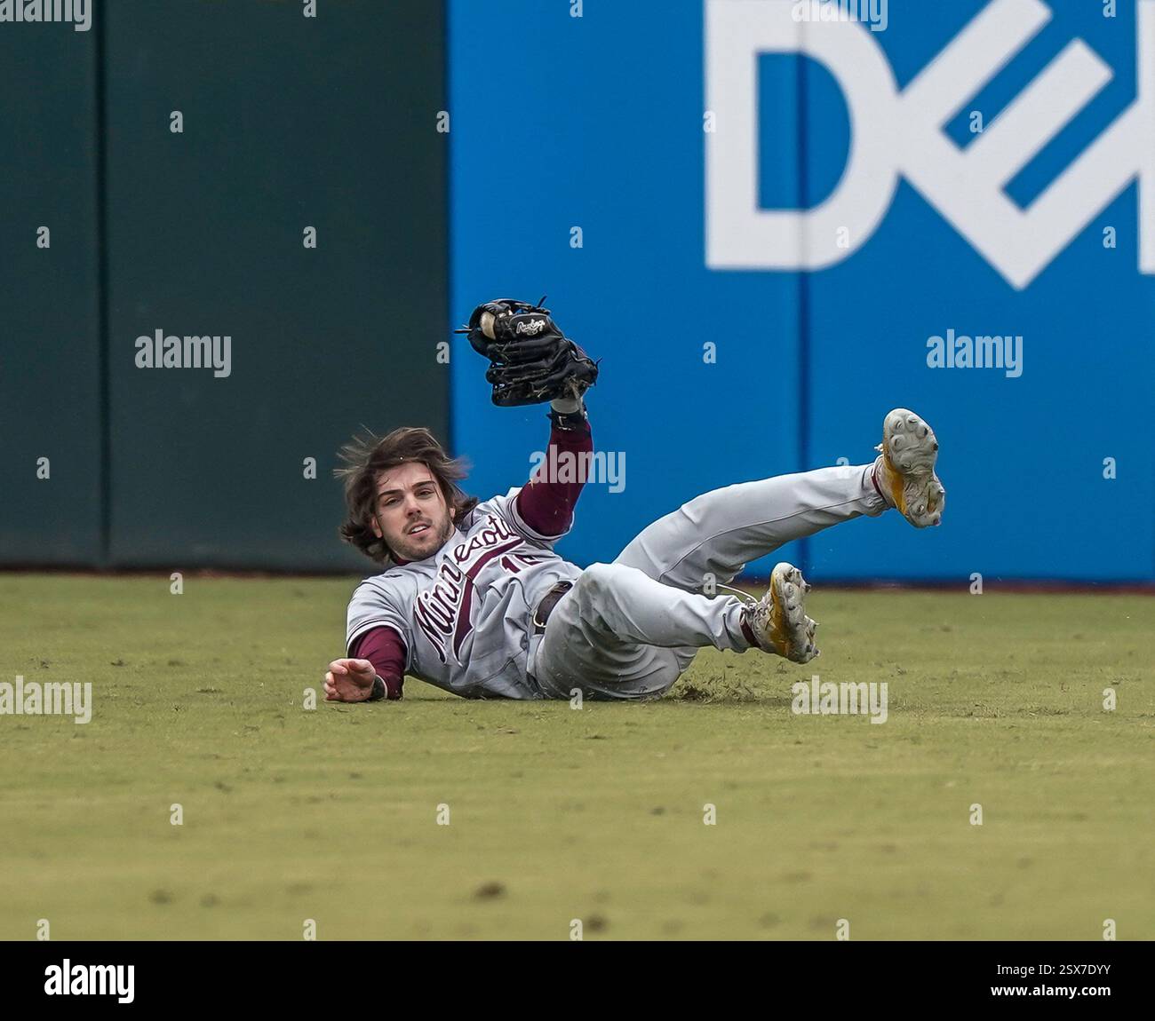 Minnesota Golden Gophers outfielder Josh Fitzgerald (16) makes a diving ...