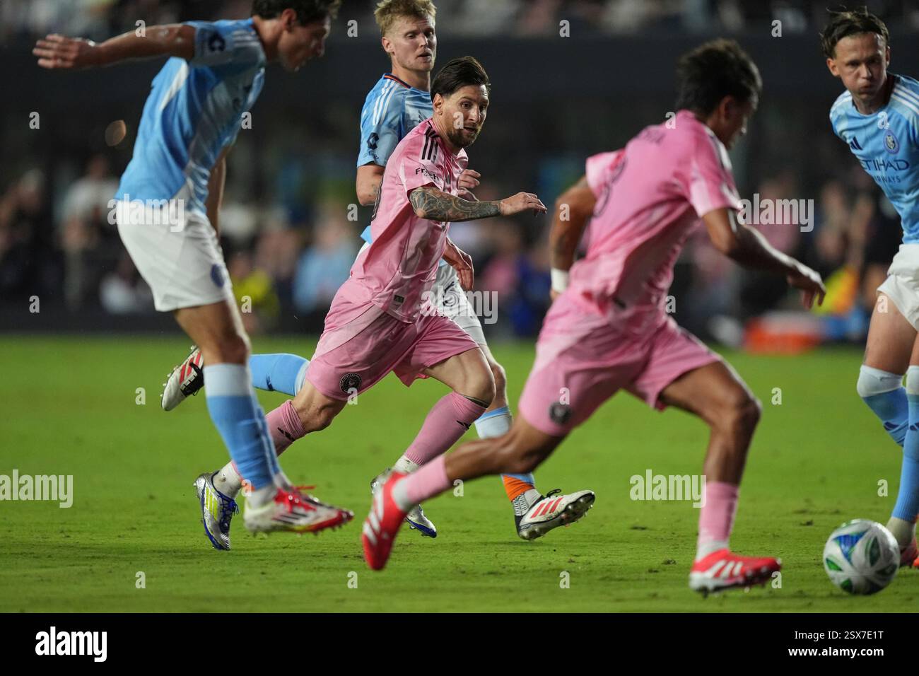 Inter Miami forward Lionel Messi, center, passes to midfielder Telasco ...