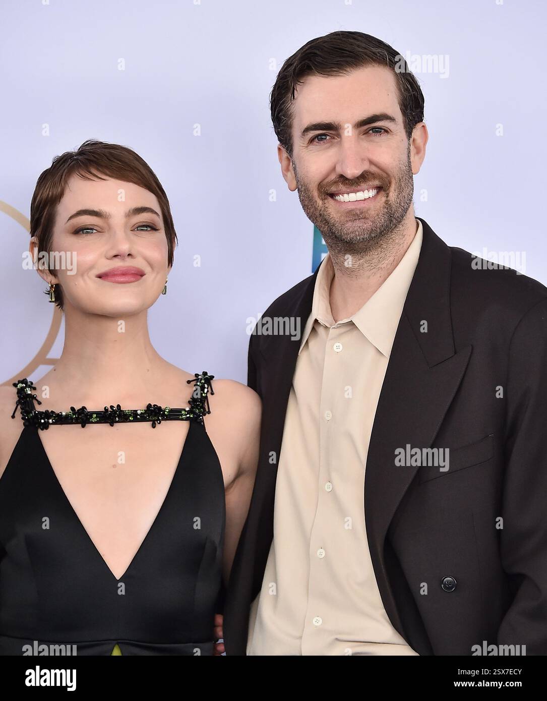 Santa Monica, USA. 22nd Feb, 2025. Emma Stone and Dave McCary arriving ...