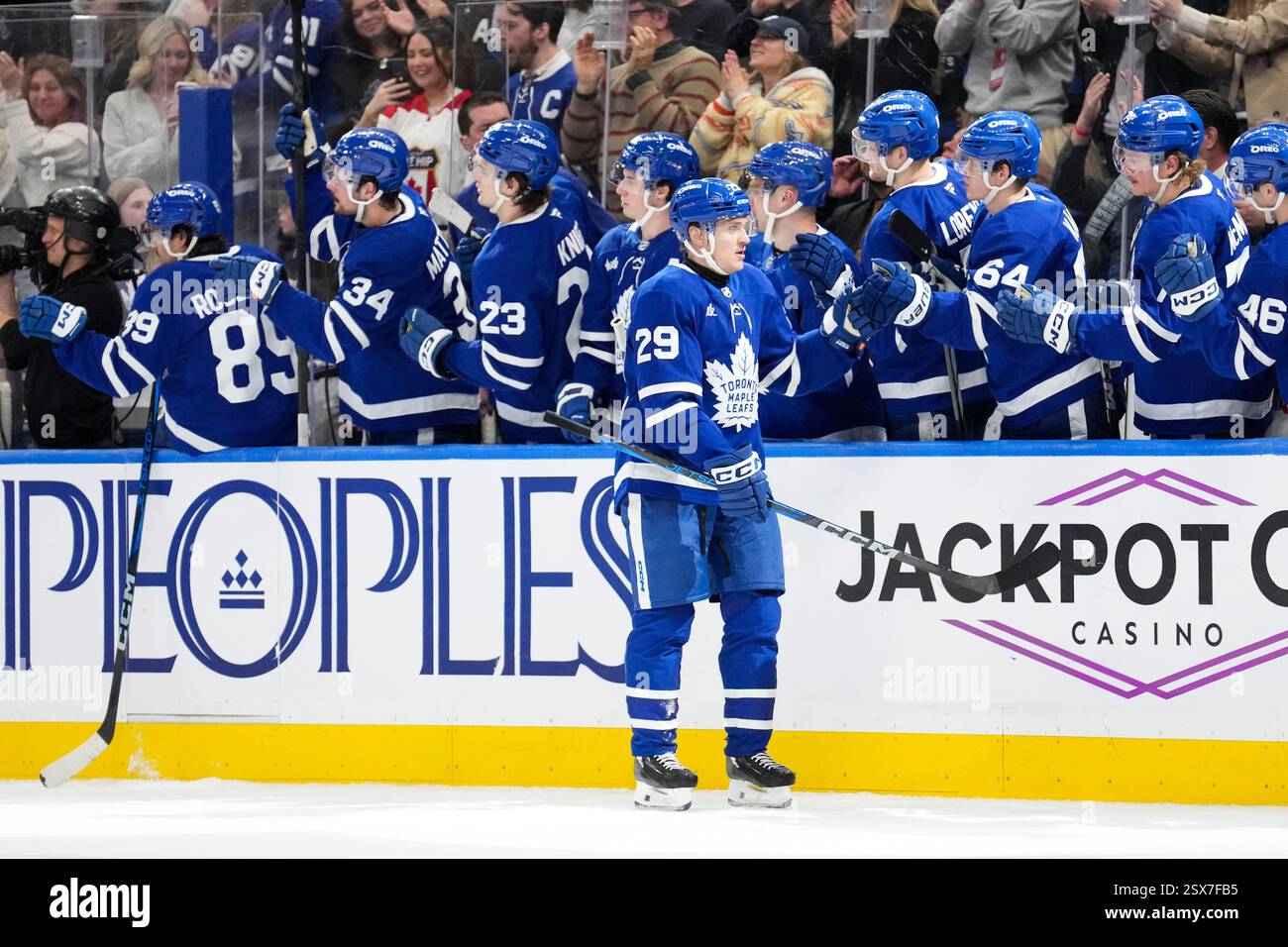 Toronto Maple Leafs right wing Pontus Holmberg (29) is congratulated by ...
