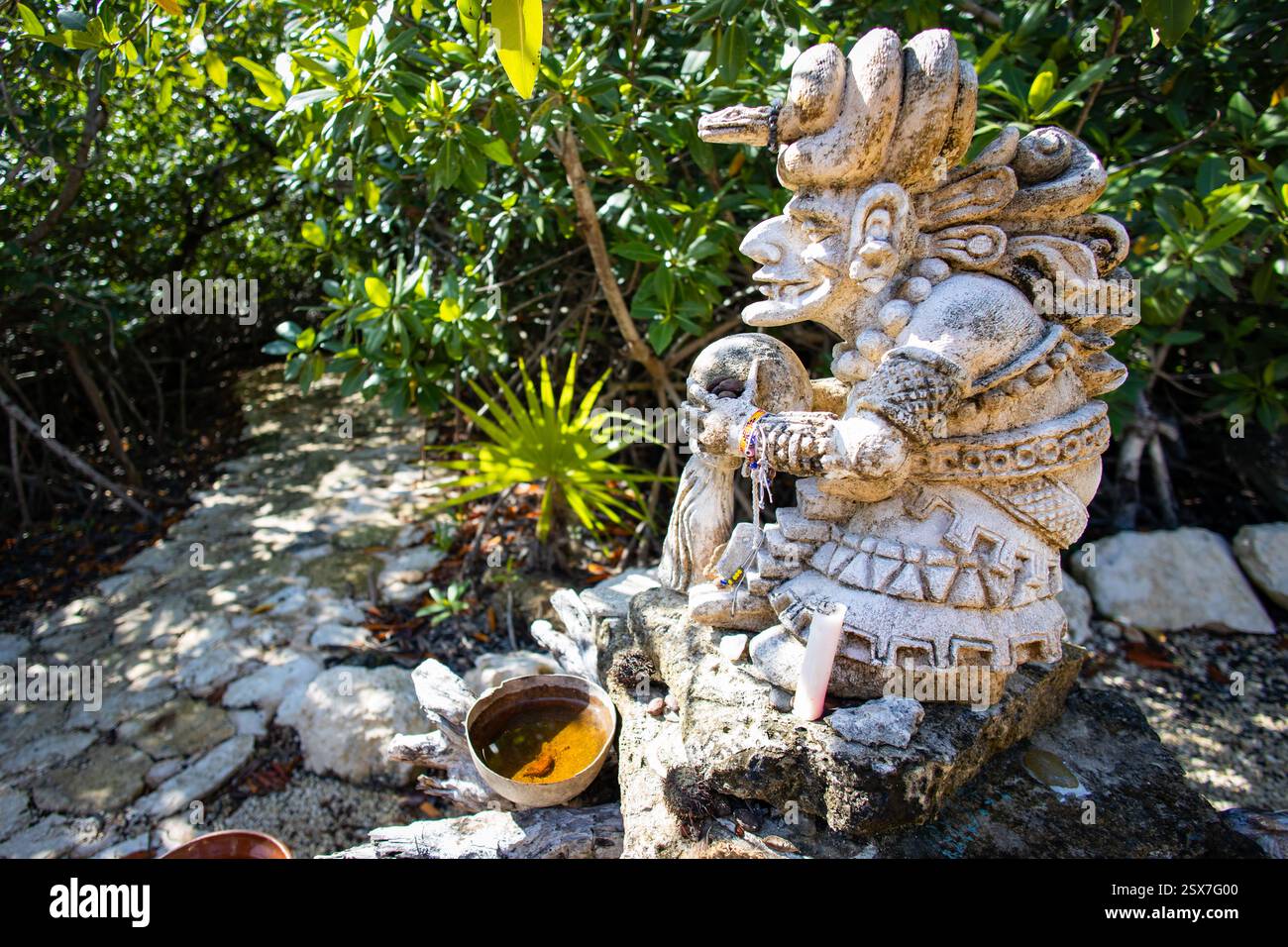 Ancient mayan statue decoration in the tropical forest tourist ...