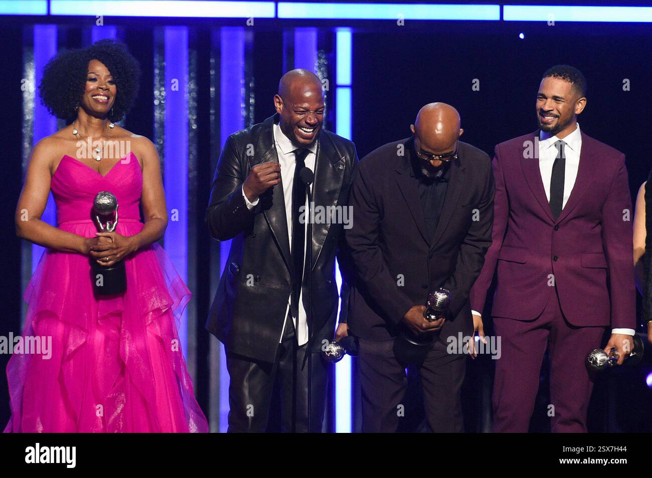 Kim Wayans, from left, Marlon Wayans, Damon Wayans Sr., and Damon Wayans Jr., accept the NACCP ...