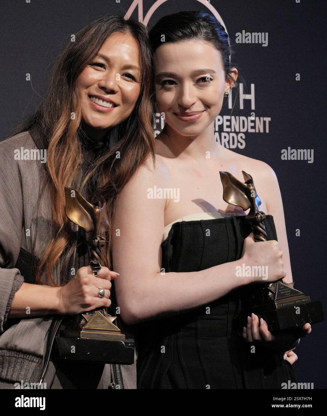 (L-R) Samantha Quan, winner of the Best Feature award for "Anora," and Mikey Madison, winner of ...