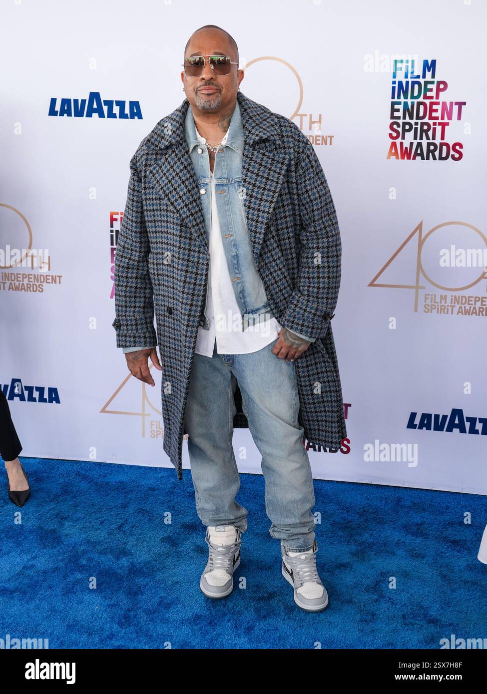 Los Angeles, USA. 22nd Feb, 2025. Kenya Barris walking on the red ...