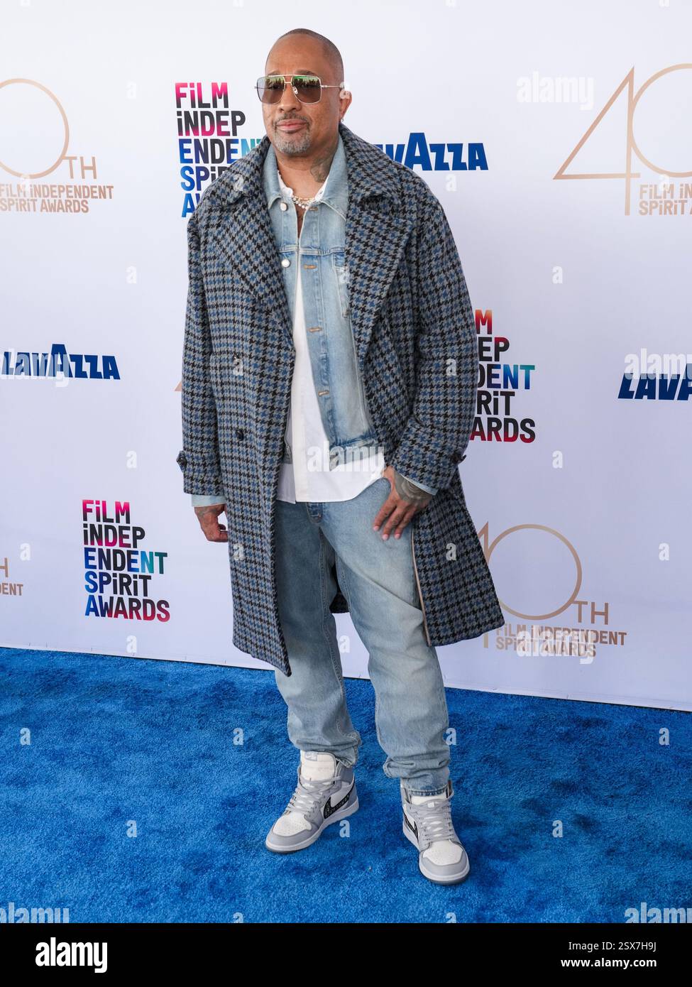 Los Angeles, USA. 22nd Feb, 2025. Kenya Barris walking on the red ...