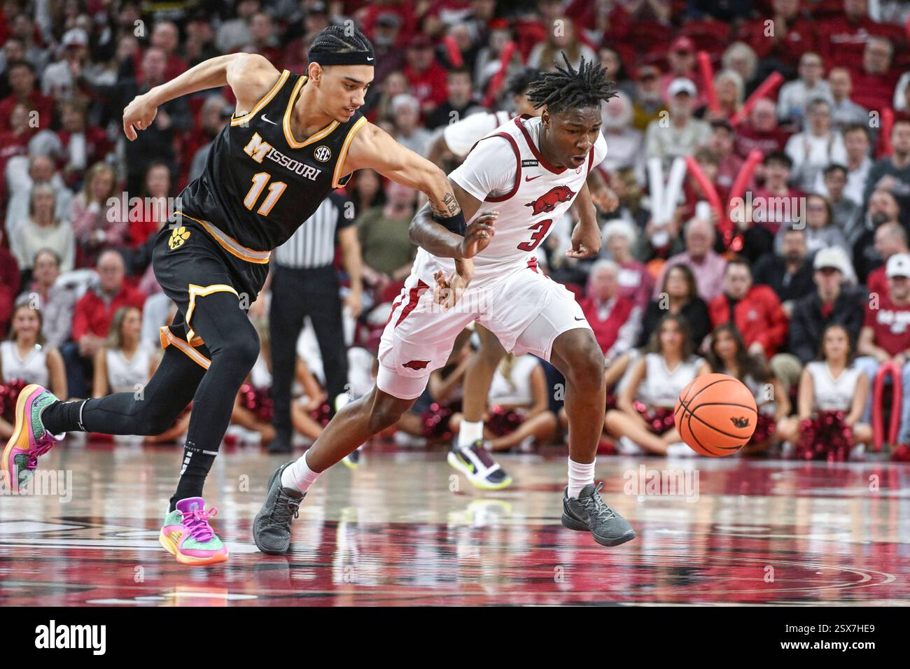 Missouri guard Trent Pierce (11) and Arkansas forward Adou Thiero (3 ...