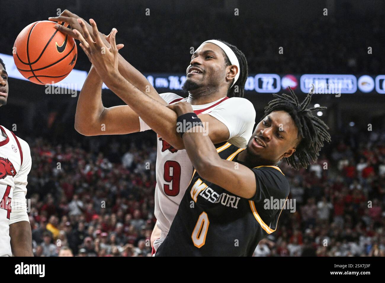 Arkansas forward Jonas Aidoo (9) and Missouri guard Anthony Robinson II ...