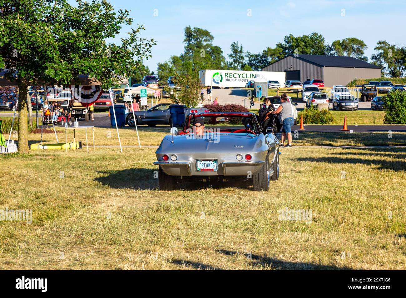 A gray 1966 Chevrolet Corvette convertible in the grass at Riverside ...