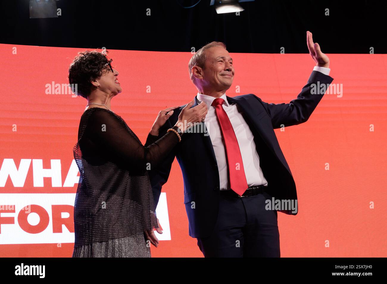 Western Australia Premier, Roger Cook leaves the stage with his wife ...