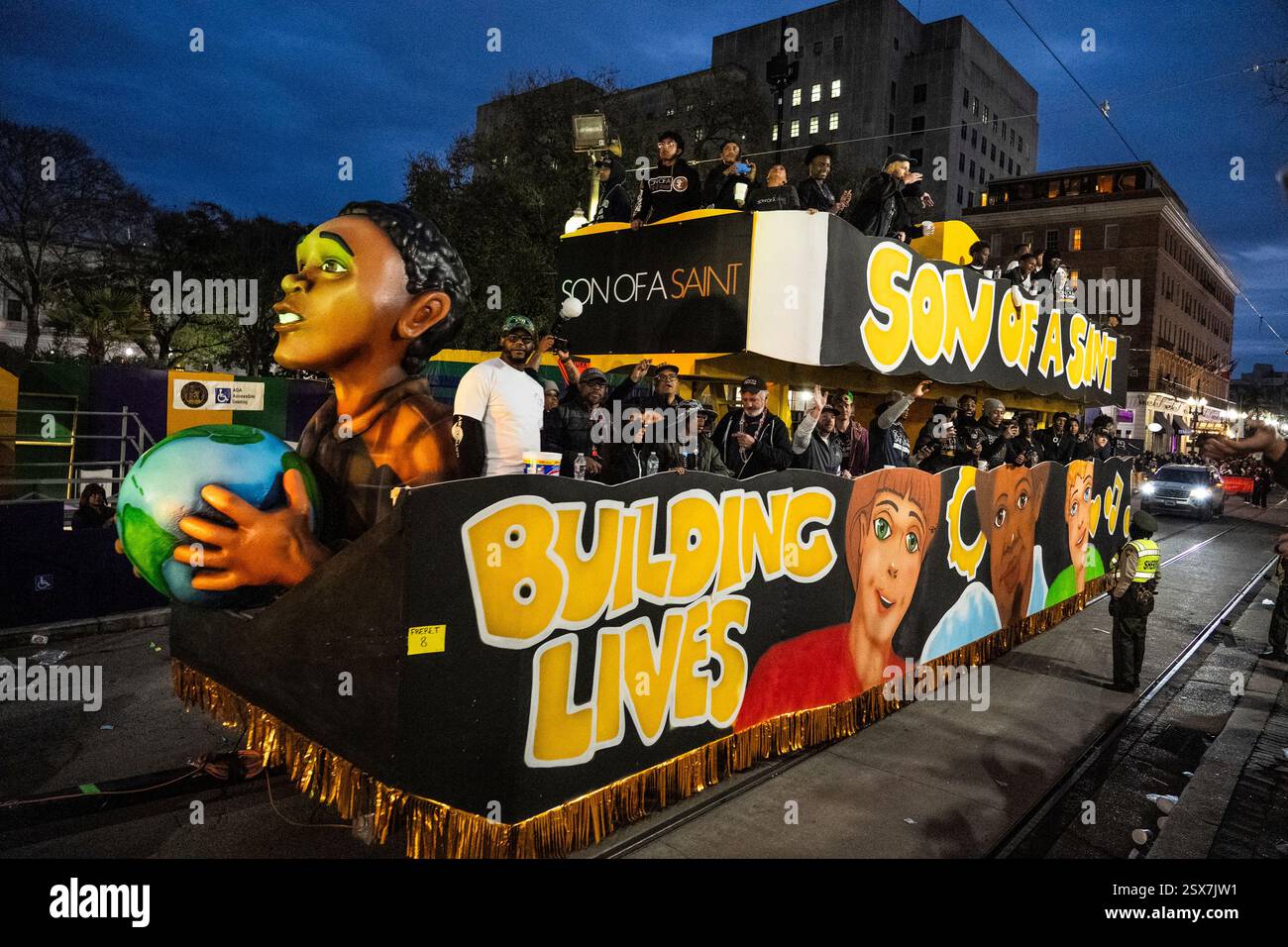Paradegoers are seen during the Krewe of Freret Mardi Gras Parade in ...