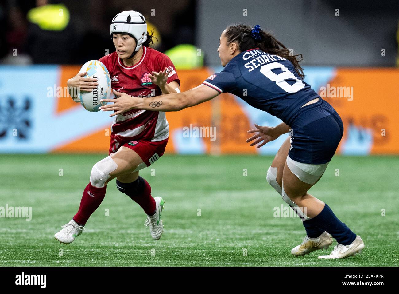 Vancouver, Canada. 22nd Feb, 2025. Japan's Honoka Tsutsumi, left, runs ...