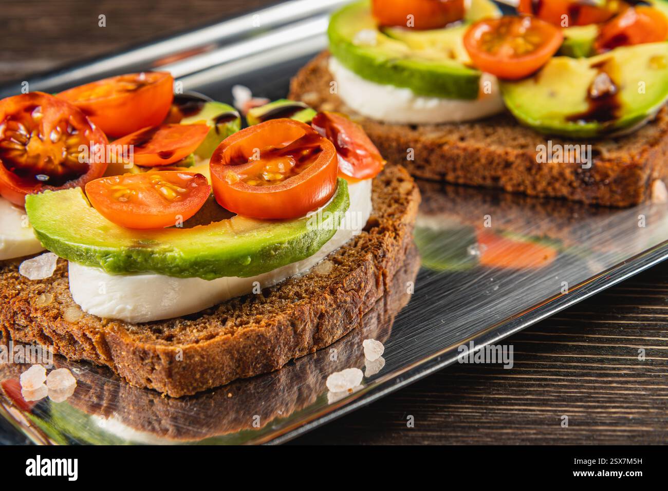 A beautifully arranged open-faced sandwich features layers of creamy ...