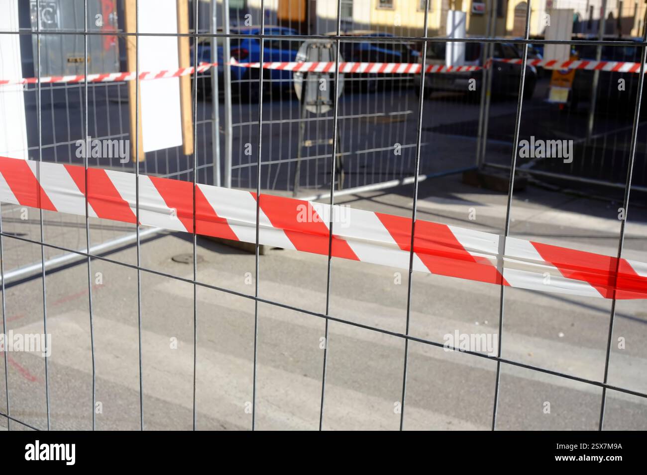 Cremona, Italy February 9th 2025 Red and white striped caution tape ...