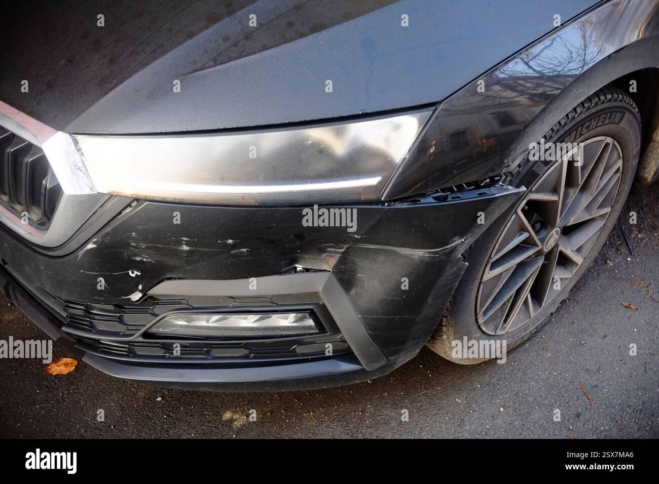 Cremona, Italy February 9th 2025 Close up of a broken bumper on a black ...