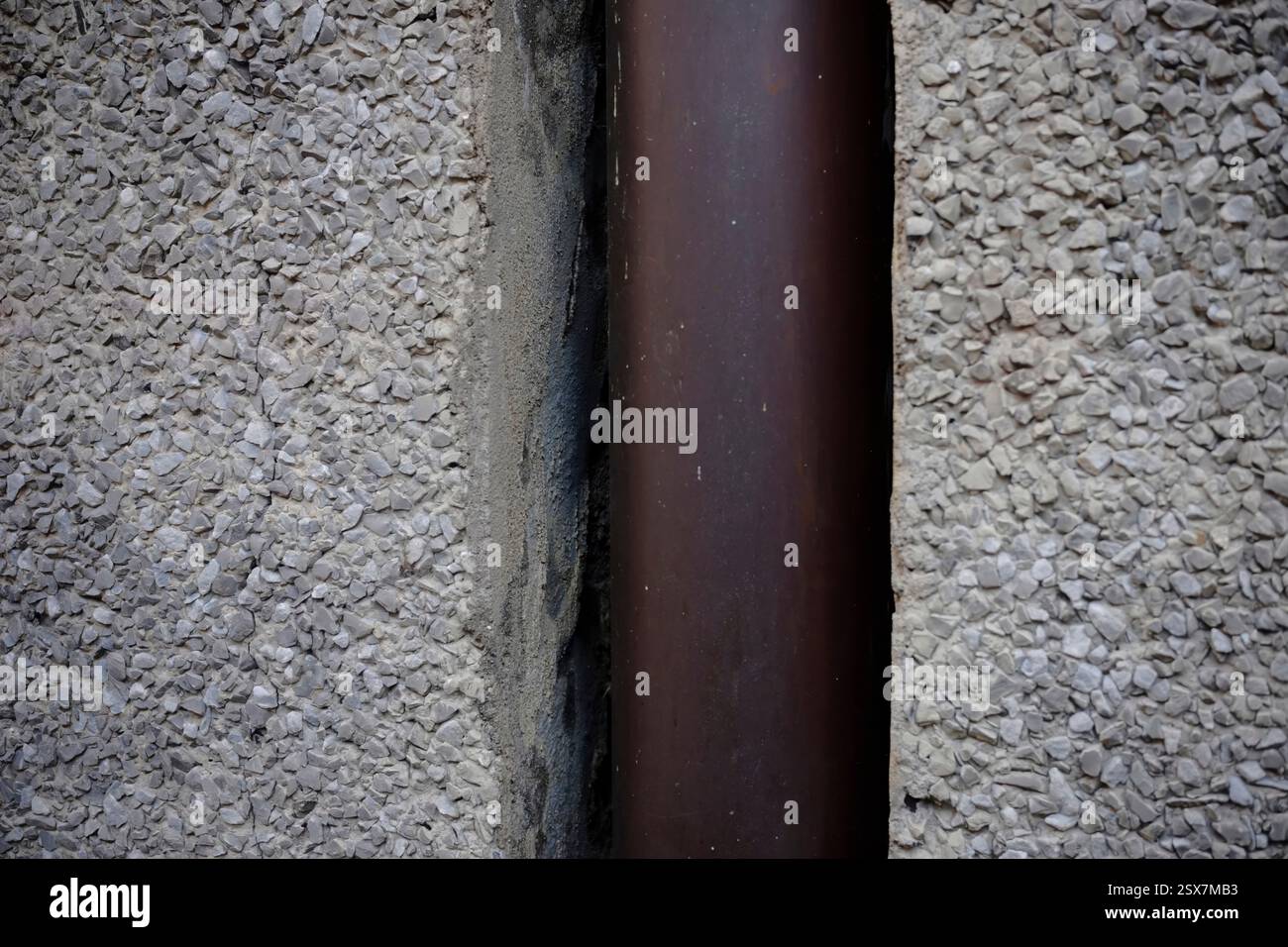 Cremona, Italy February 9th 2025 Vertical close up of a brown downspout ...