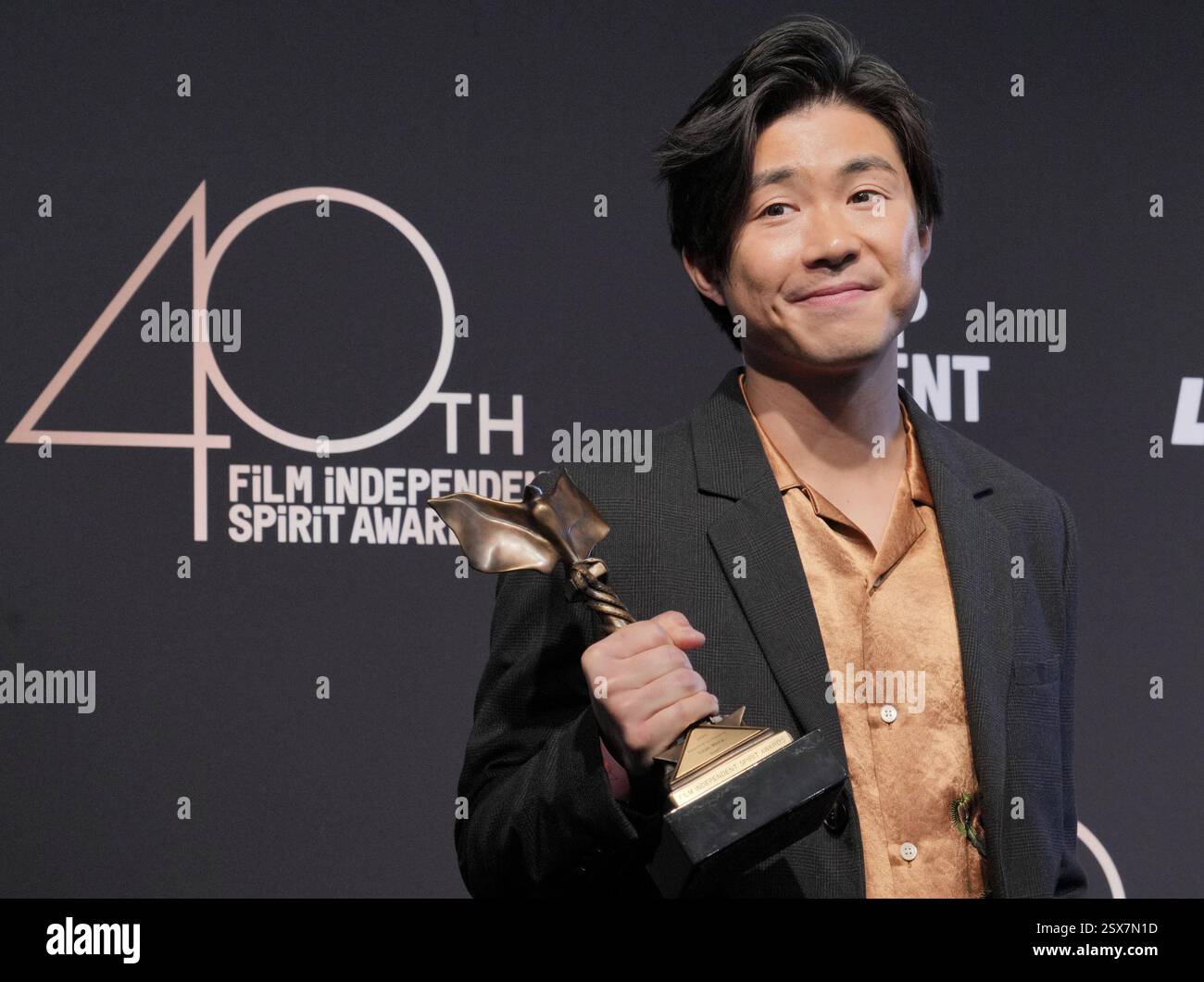 Sean Wang, winner of the Best First Screenplay award for "Dìdi" pose in ...